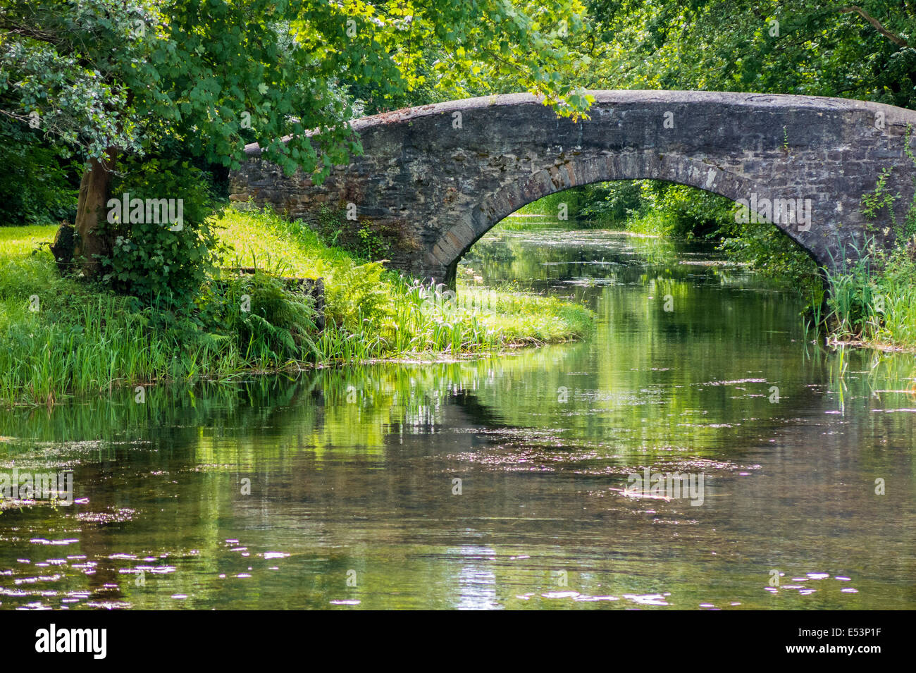 Stone bridge crossing the Neath canal at Resolven in South Wales Stock ...