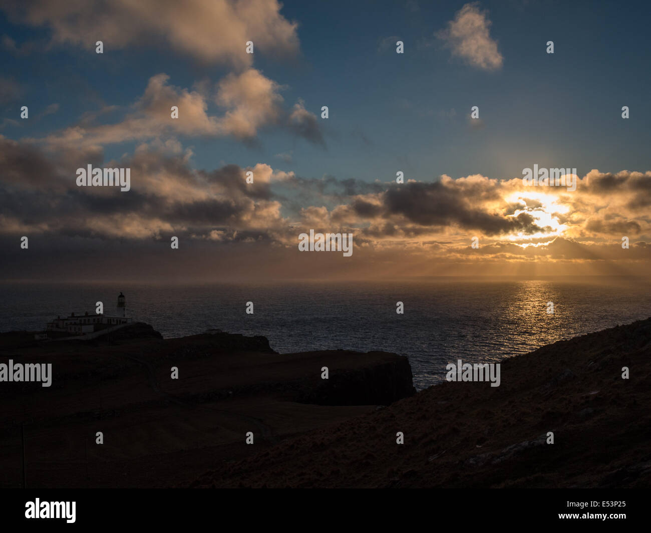 Sun setting down over the sea at Neist Point Stock Photo - Alamy