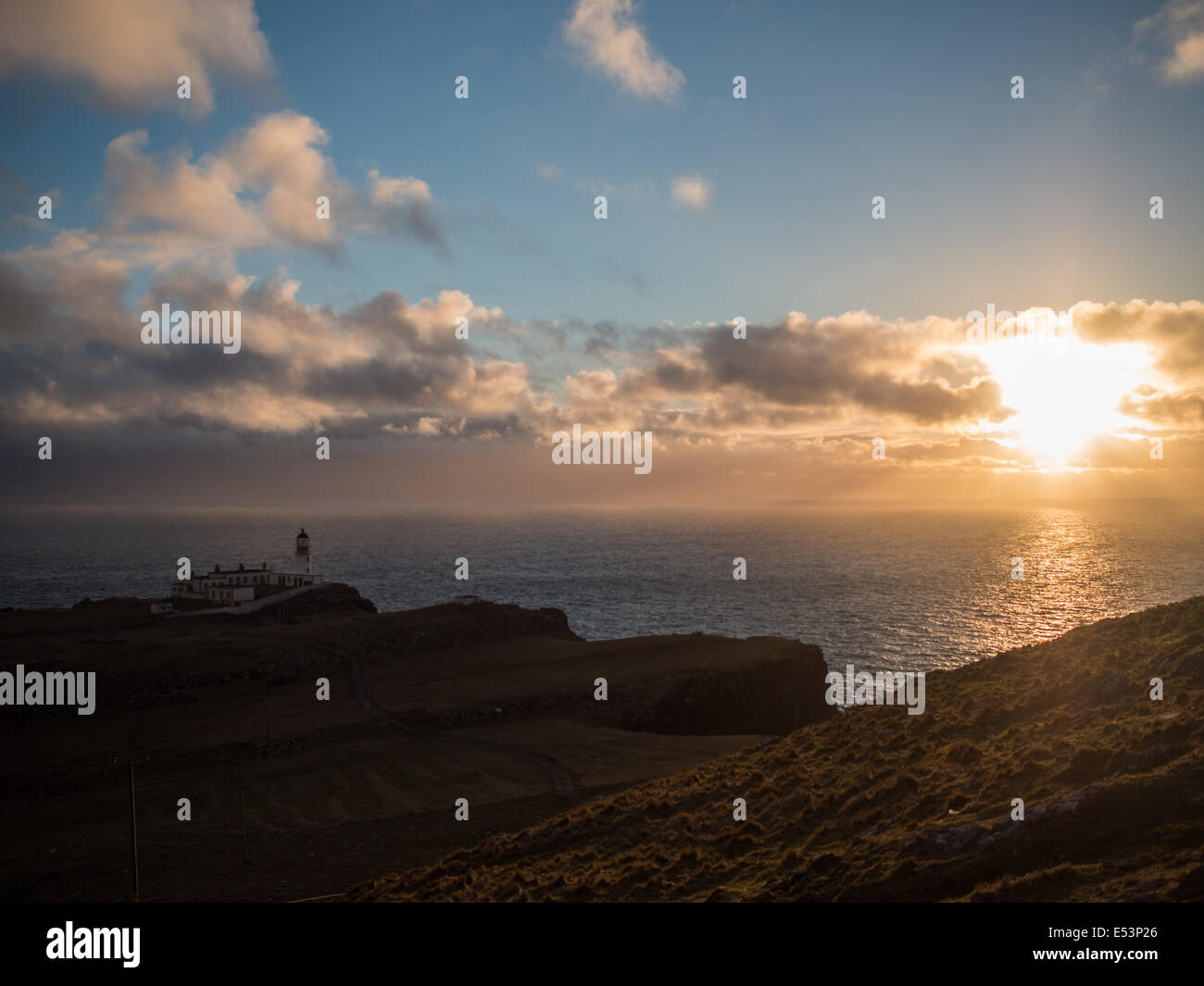 Sun setting down over the sea at Neist Point Stock Photo - Alamy