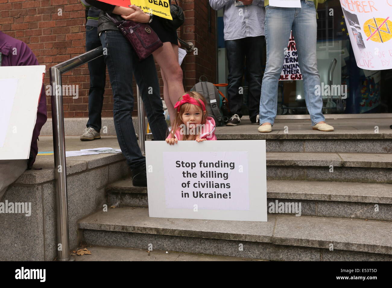 A young girl holds a protest sign during the Anti-Fascist Resistance ...