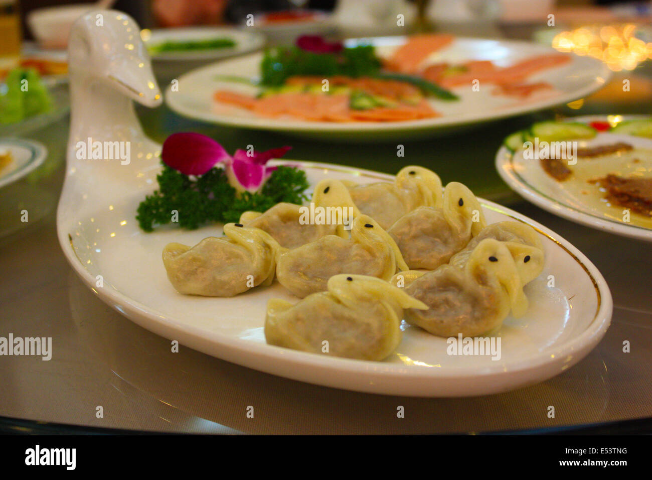 Dumplings in the shape of Ducks, on a white Duck shaped platter Stock ...