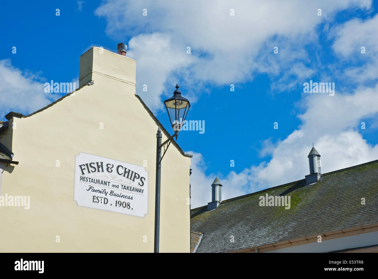 Sign on wall for fish & chip shop Stock Photo - Alamy