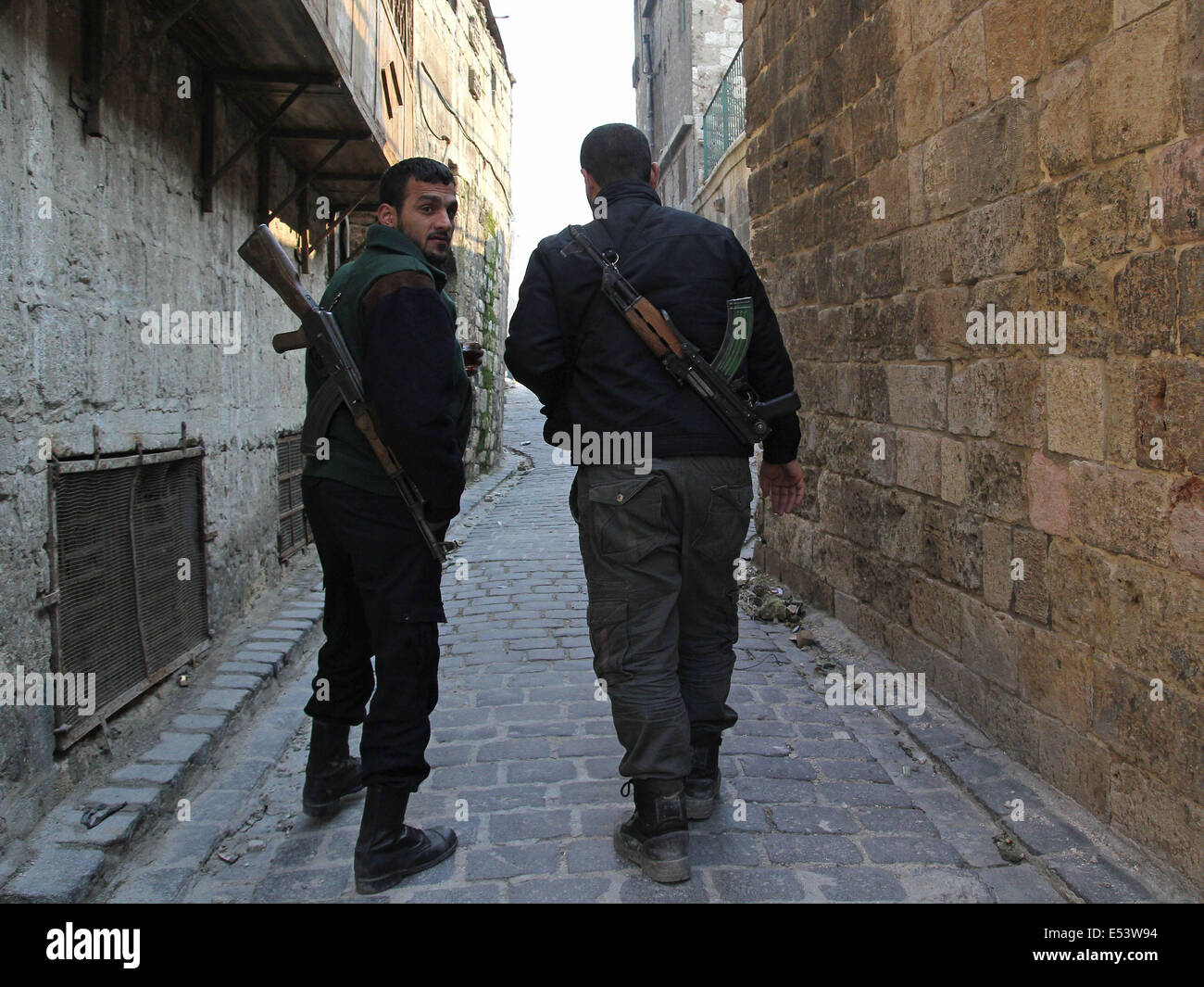 Aleppo, Syria. 14th Jan, 2013. Two FSA fighters walk through the ...
