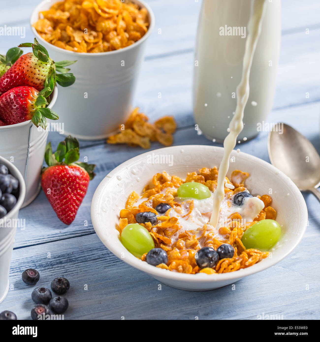 Cornflakes with fruits flooded with milk Stock Photo - Alamy
