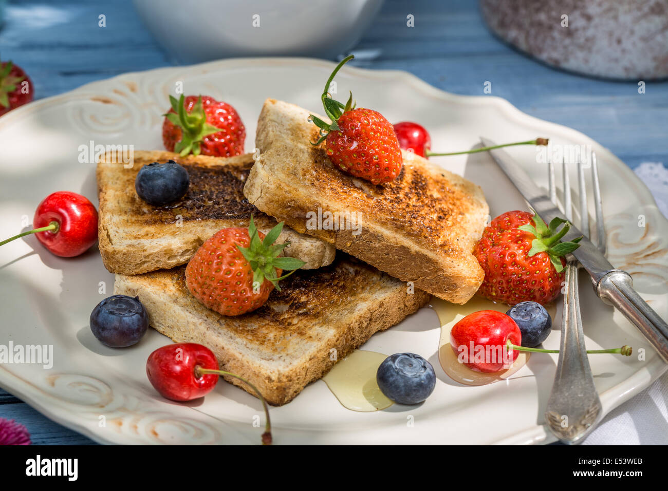 Toast with fruit and honey for breakfast Stock Photo - Alamy