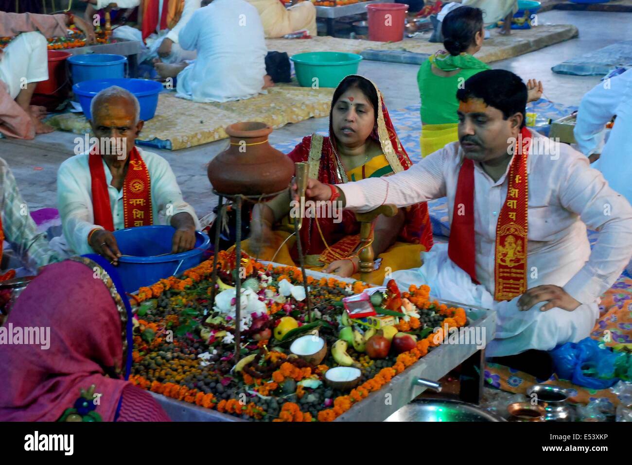Devotees perform rituals during the Rudra Abhishek Pooja in Sawan month ...
