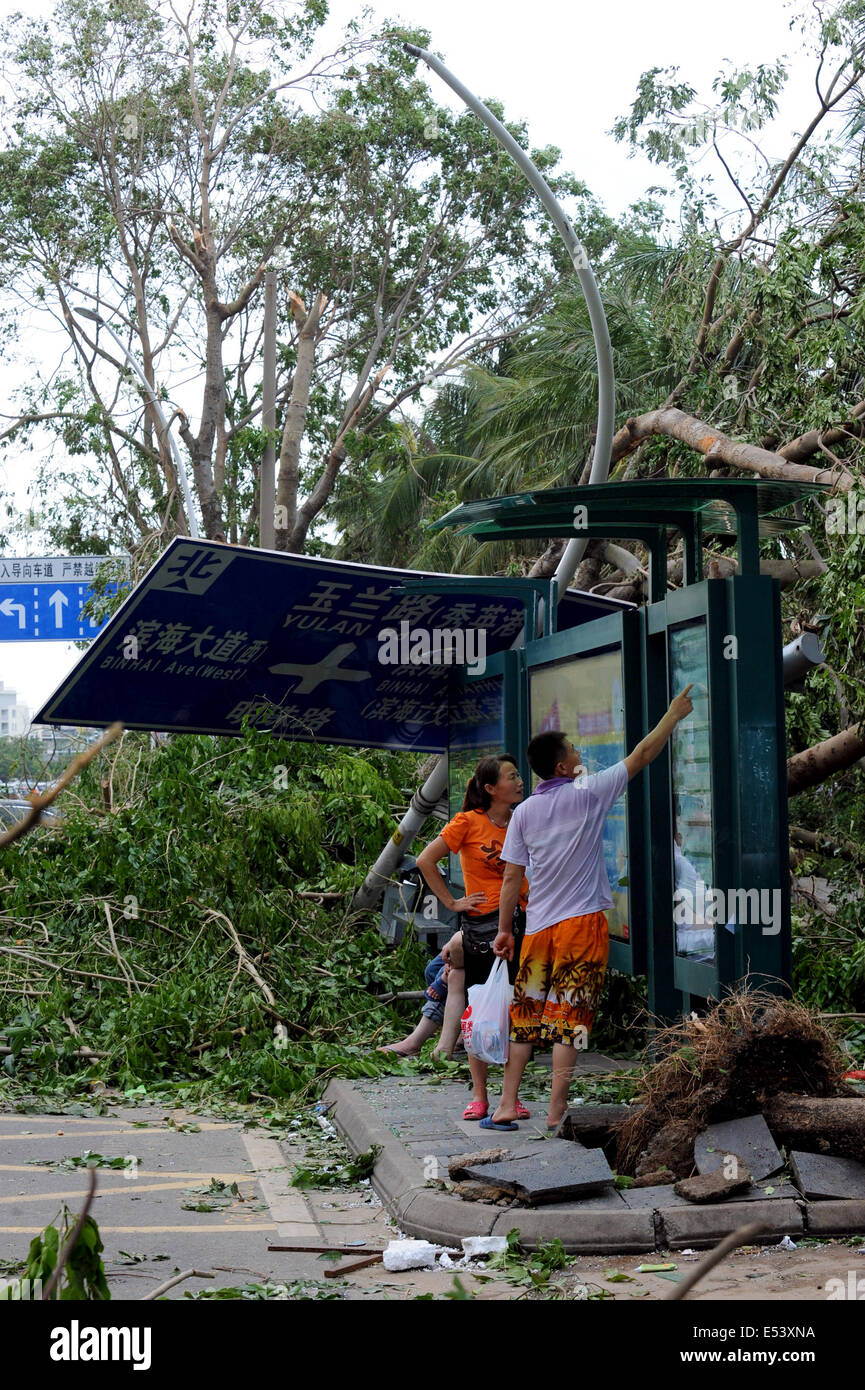 Haikou, China's Hainan Province. 19th July, 2014. Residents wait for ...