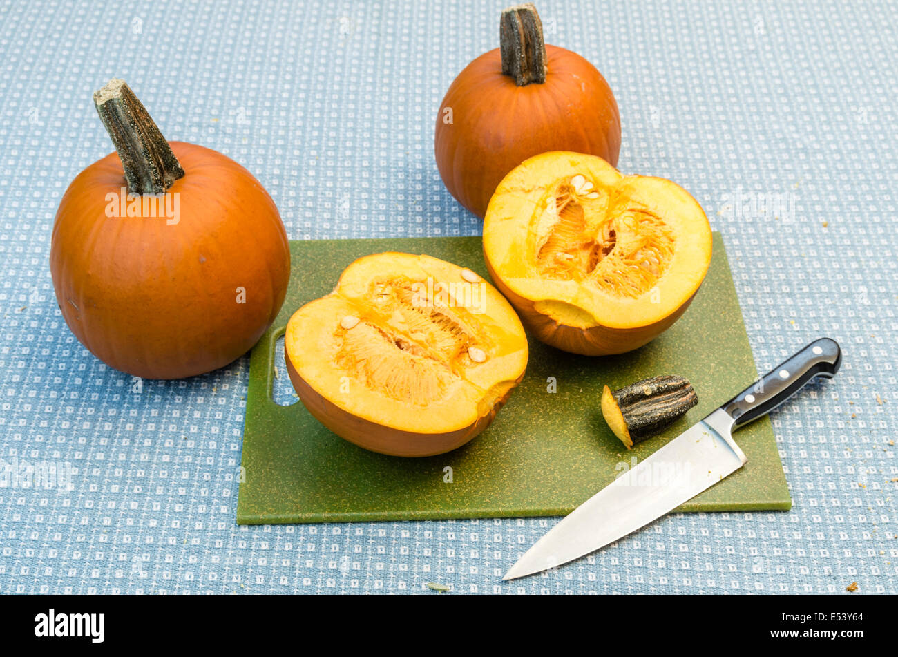 Pumpkins cut open to extract the seeds Stock Photo - Alamy