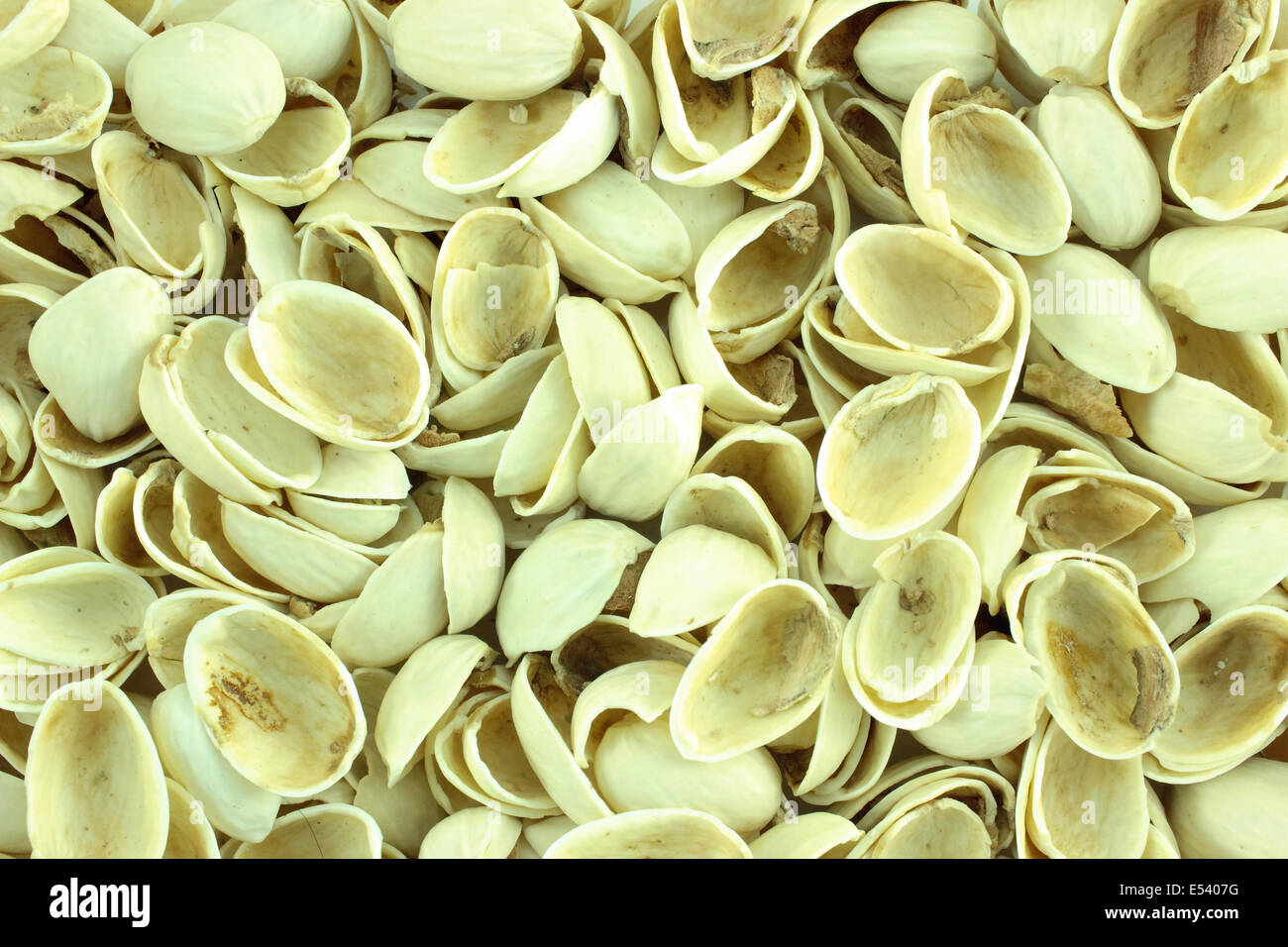 A Pistachios nut shell background Stock Photo - Alamy