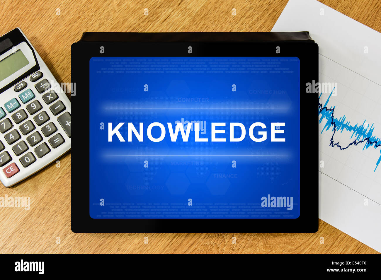 knowledge word on digital tablet with calculator and financial graph ...