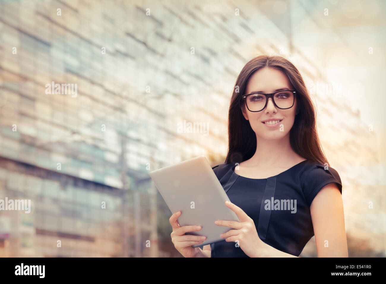 Young Woman with Tablet Out in the City Stock Photo - Alamy
