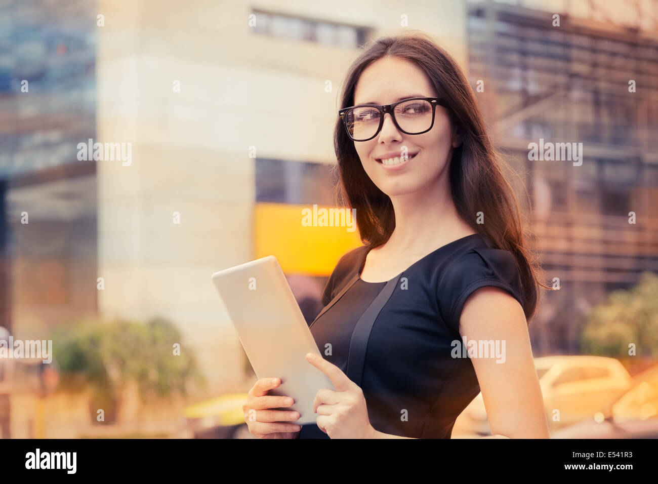Young Woman with Tablet Out in the City Stock Photo - Alamy