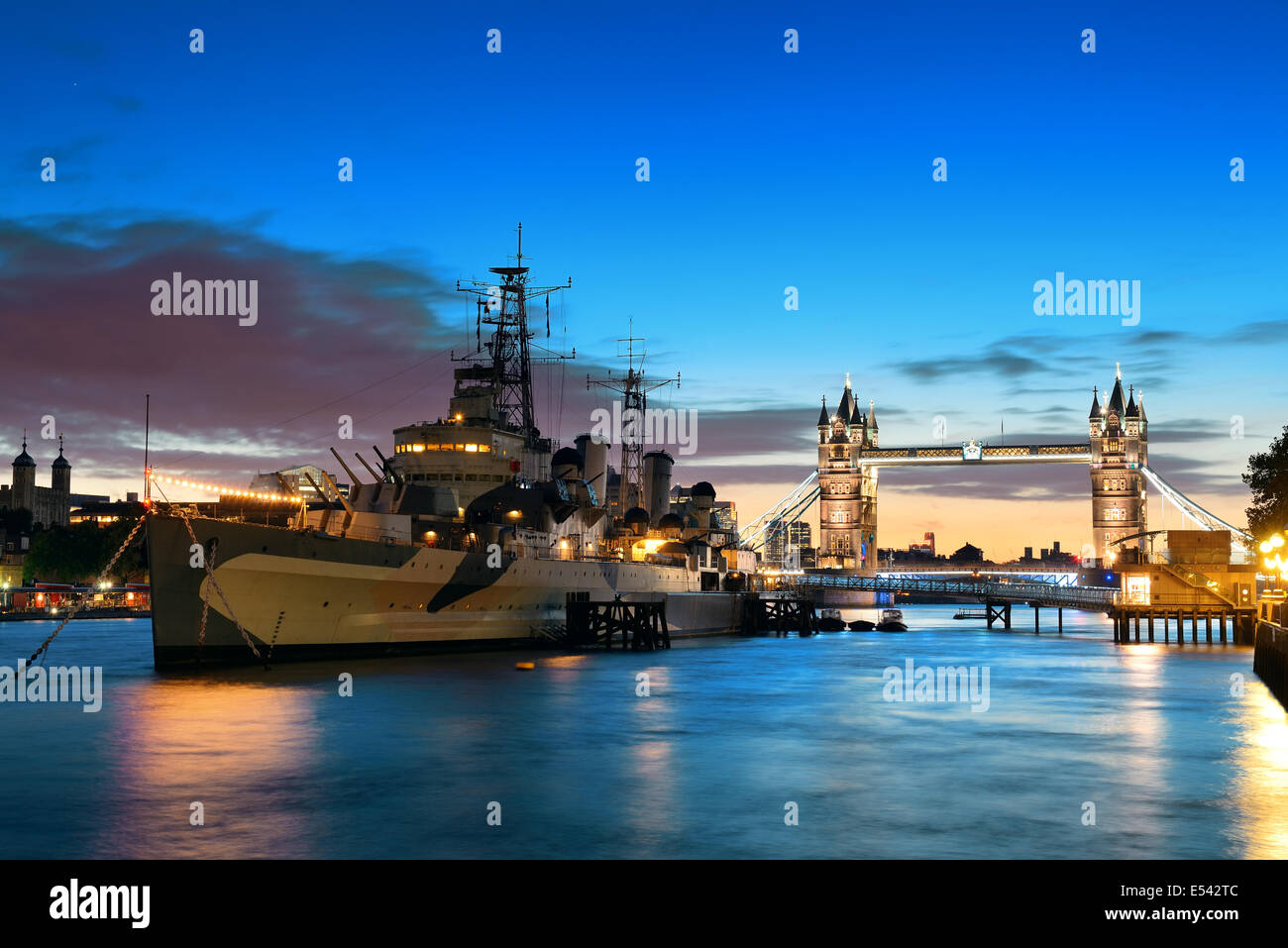 HMS Belfast warship and Tower Bridge in Thames River in London Stock ...