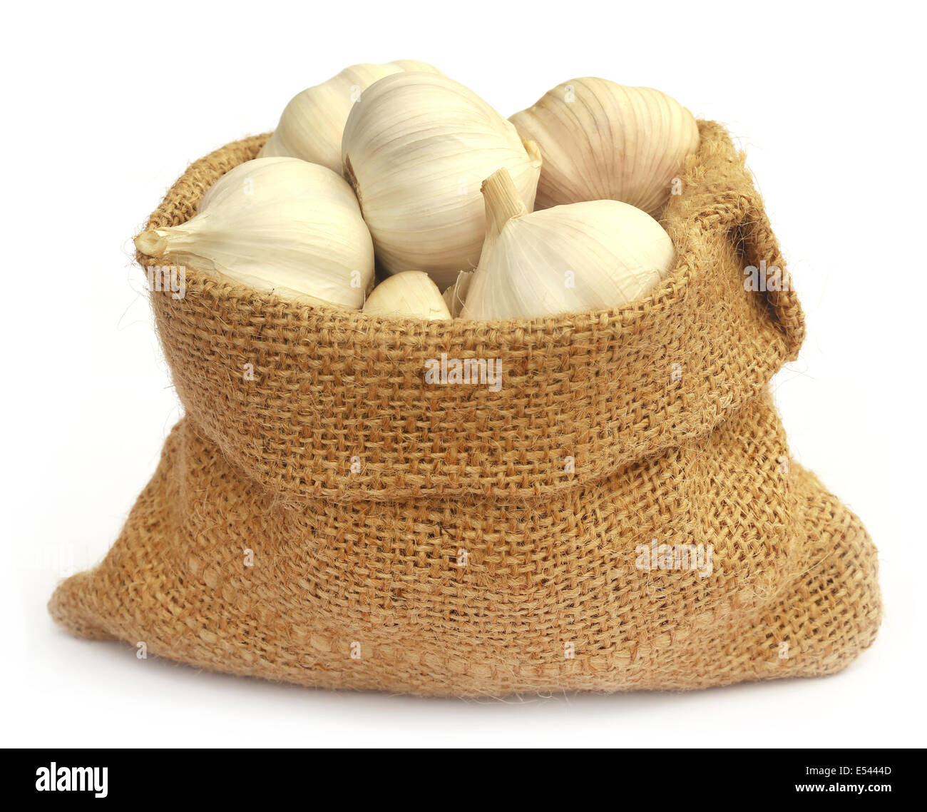 Garlic in a sack over white background Stock Photo - Alamy