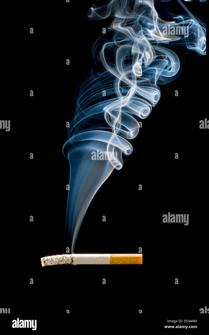 Rising smoke from filter tipped cigarette hi-res stock photography and ...