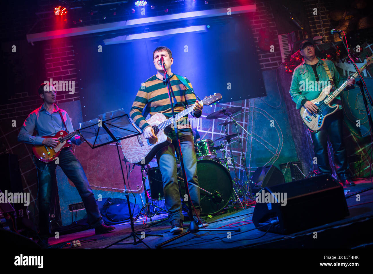 Band performs on stage, rock music concert in a nightclub Stock Photo ...