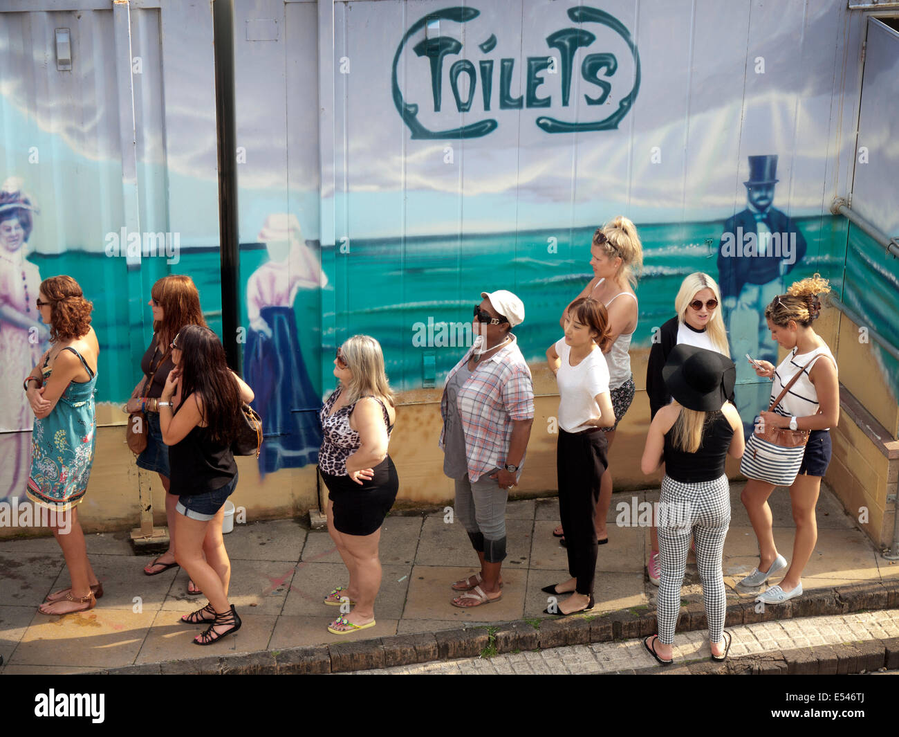 Women queue for the toilet on the Brighton seafront Stock Photo - Alamy