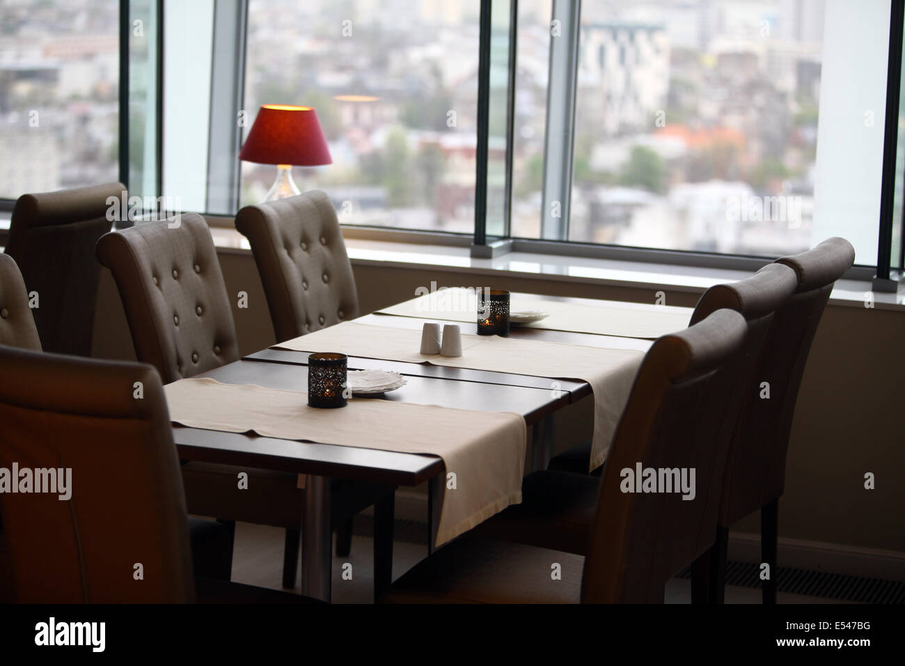 Interior with a restaurant table with chairs Stock Photo - Alamy