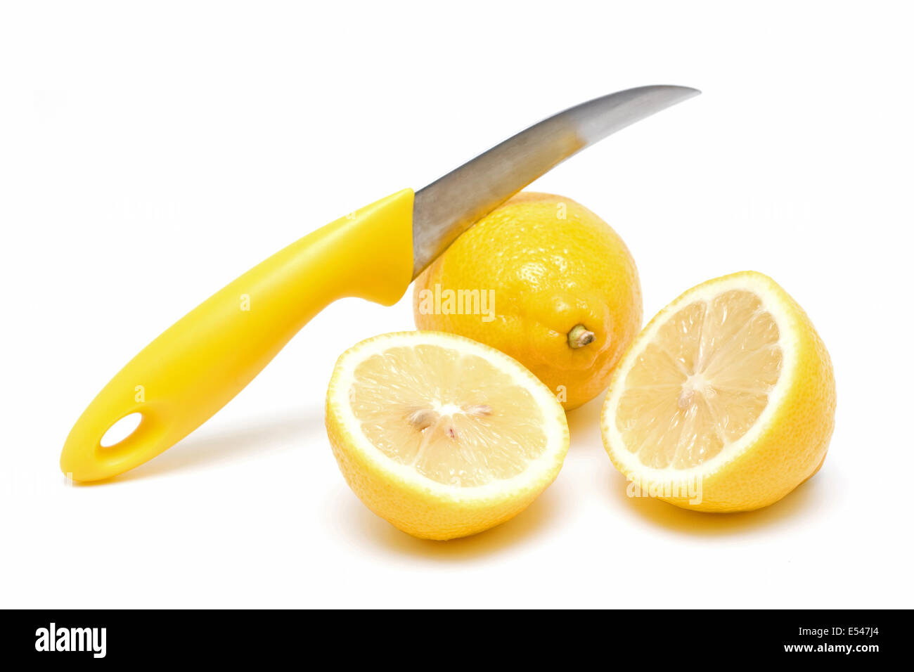 Lemons and Knife isolated on white background Stock Photo - Alamy