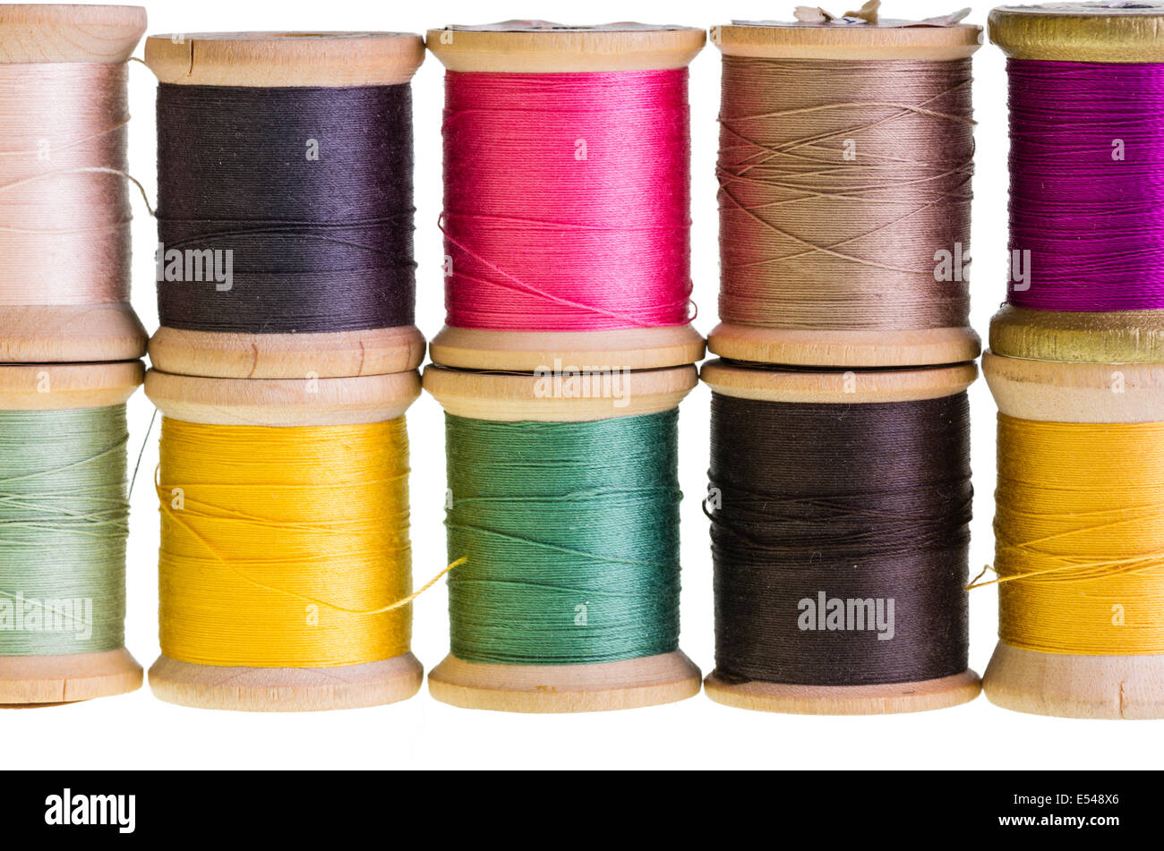 Group of spools of sewing thread isolated on white Stock Photo - Alamy