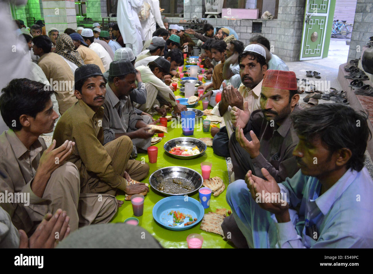 Quetta, Pakistan. 20th July, 2014. Pakistani Muslims pray before ...