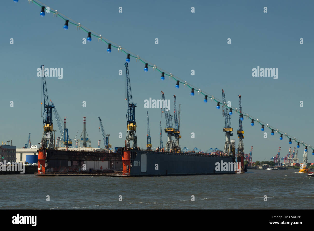 A color photograph of a floating dock in Hamburg harbor, Germany. The ...