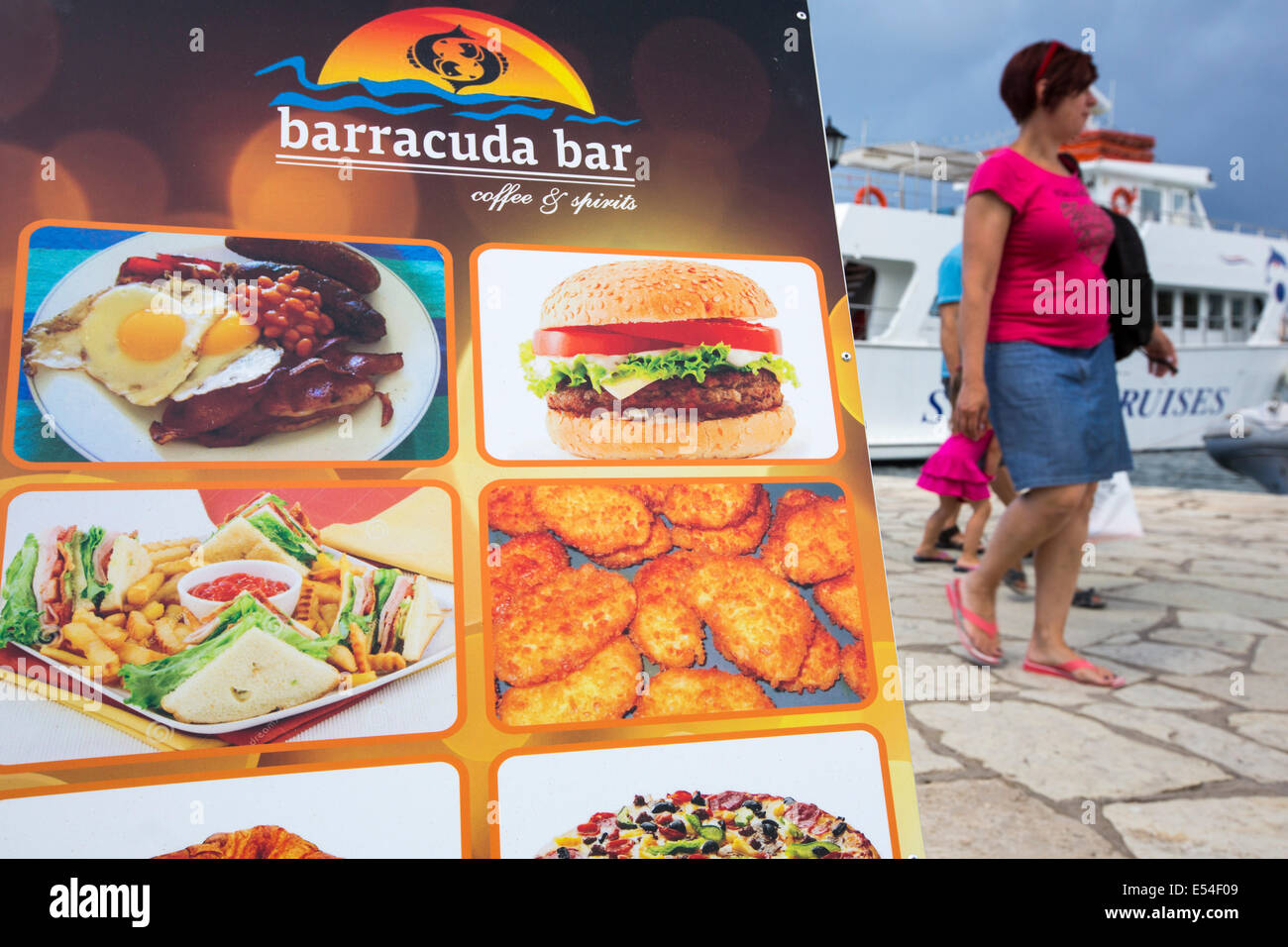 A menu board outside a seafront restaurant in Sivota, Greece Stock ...