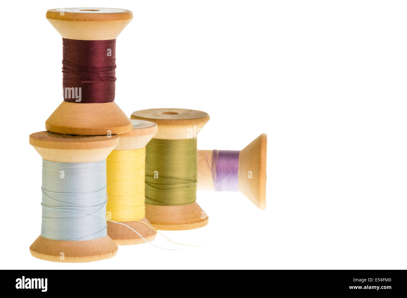 Five spools of sewing thread isolated on white Stock Photo - Alamy