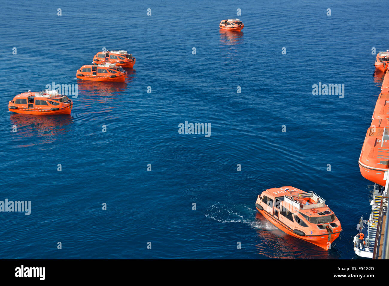 Cruise ship lifeboats in sea testing operational procedures & to serve ...
