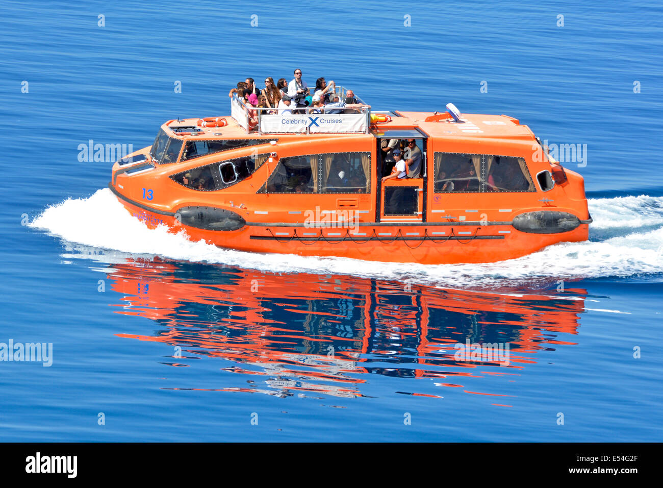 Lifeboat tender & cruise ship passengers being ferried from off shore ...