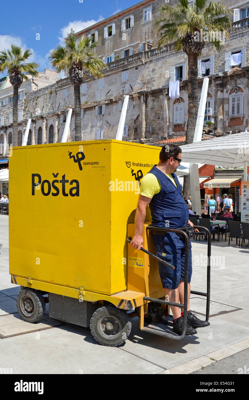 Postman driving an unusual Posta delivery vehicle in Split town centre ...