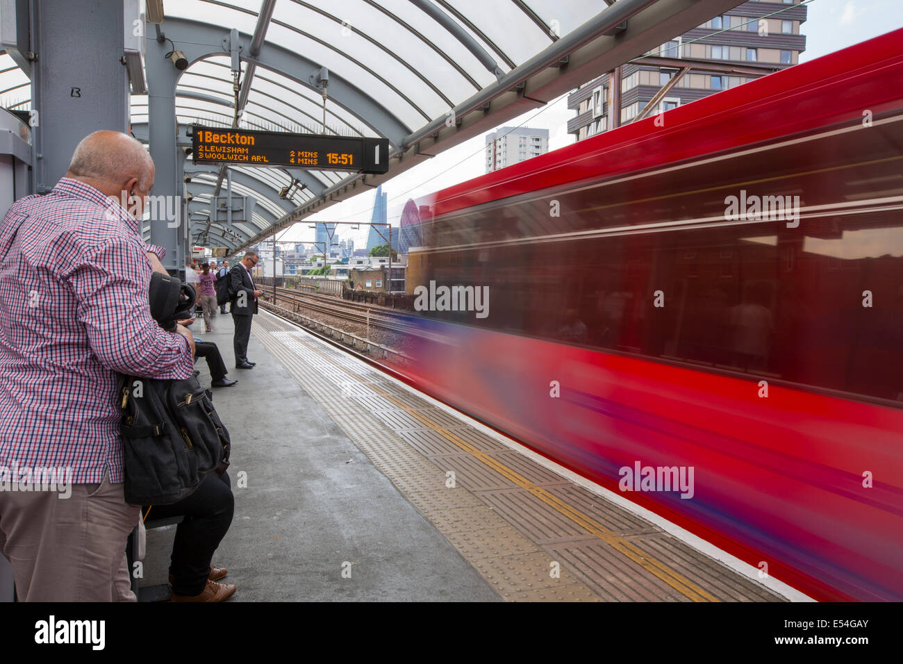 A Docklands Light Railway train (DLR) at a station near Canary wharf ...