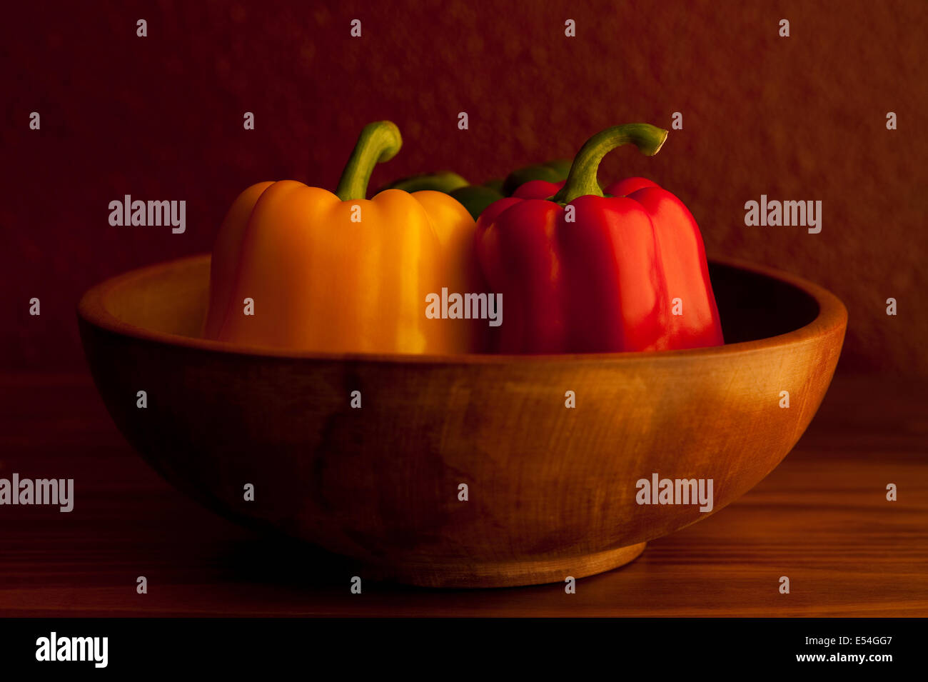 Peppers still life close-up in wooden bowl Stock Photo - Alamy