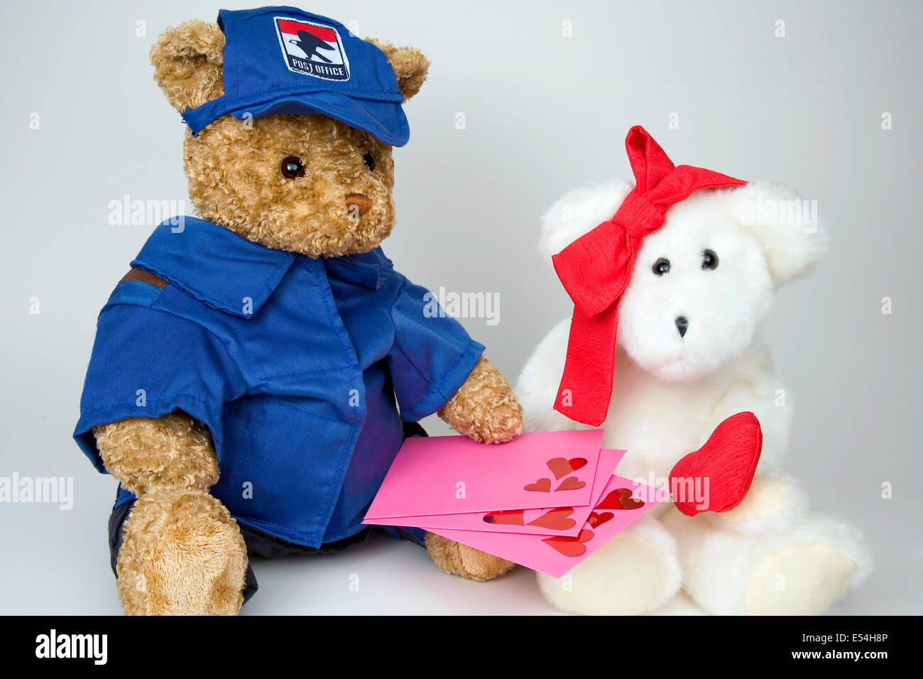 Teddy bear dressed as a postman delivering Valentines to a girl bear ...