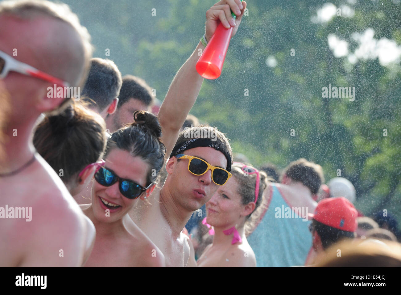 Freiburg, Germany. 19th July, 2014. Techno fan sprays water on a hot ...