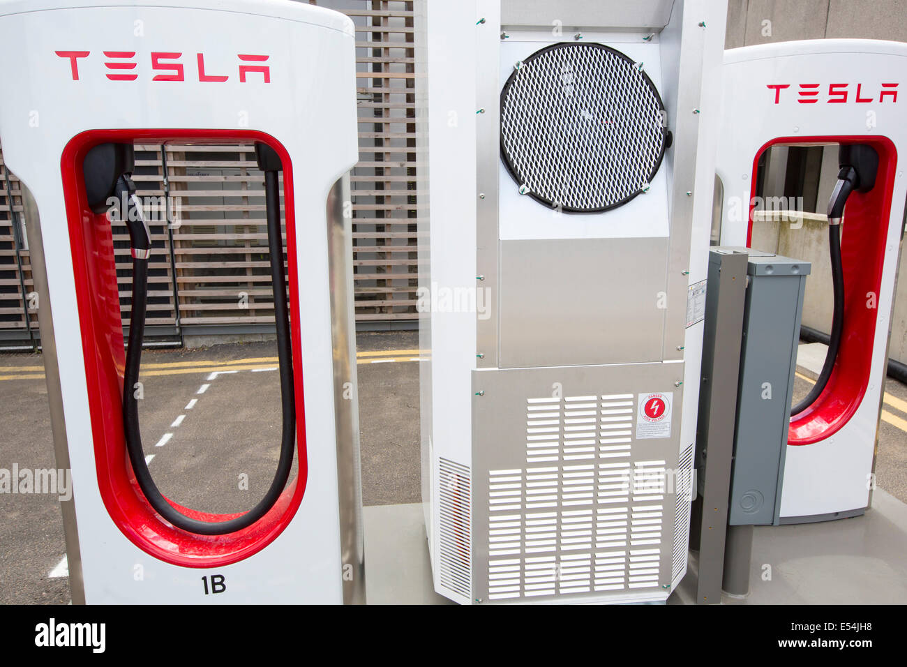 A Tesla electric vehicle recharging station at the Crystal building ...