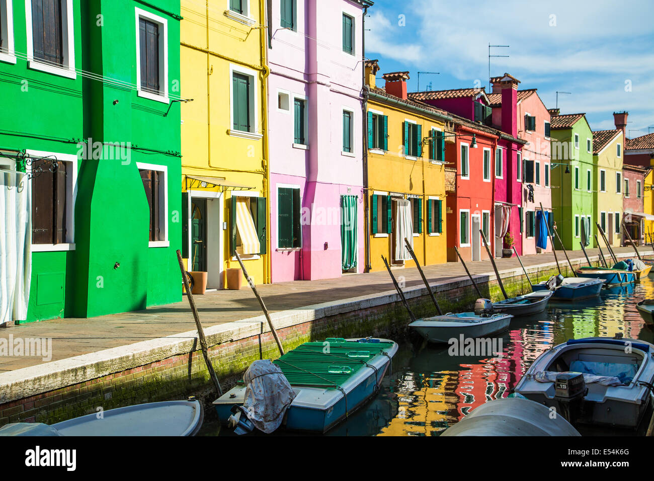 Row of brightly colored homes in Burano, Italy Stock Photo - Alamy