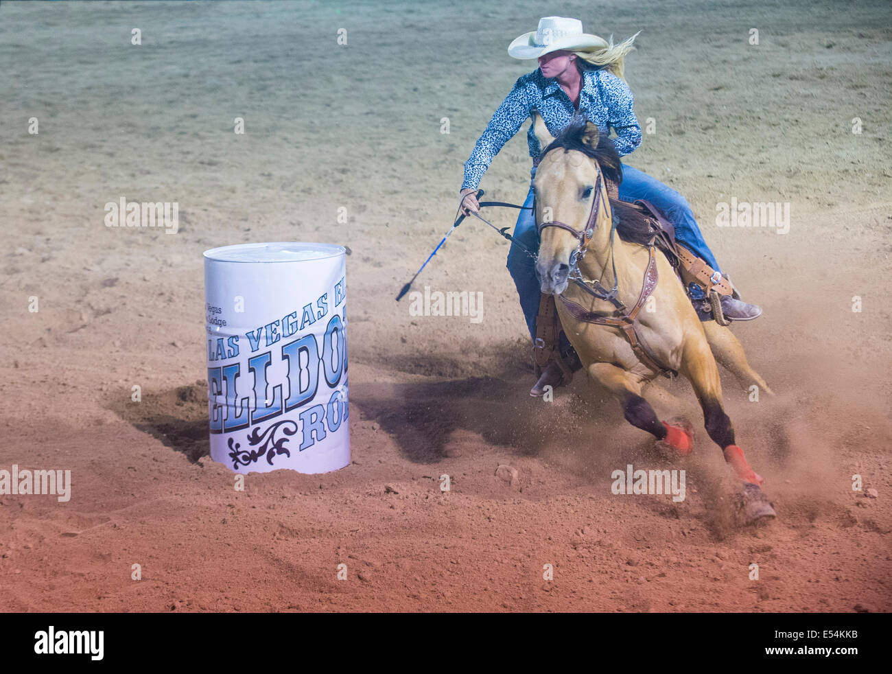 Cowgirl Participating in a Barrel racing competition at the Helldorado ...