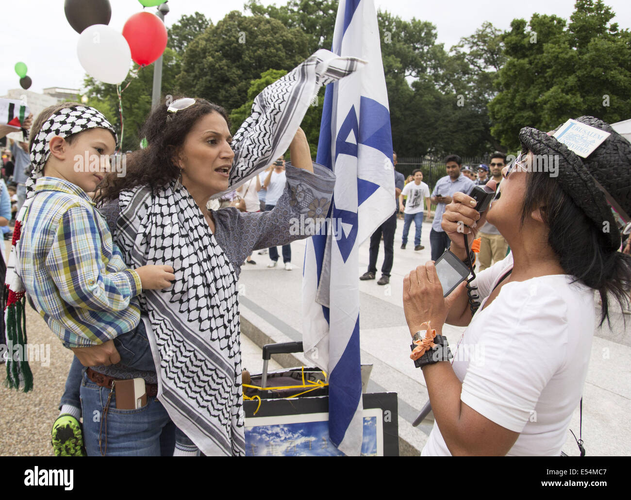 Washington, District of Columbia, USA. 20th July, 2014. Two women yell ...