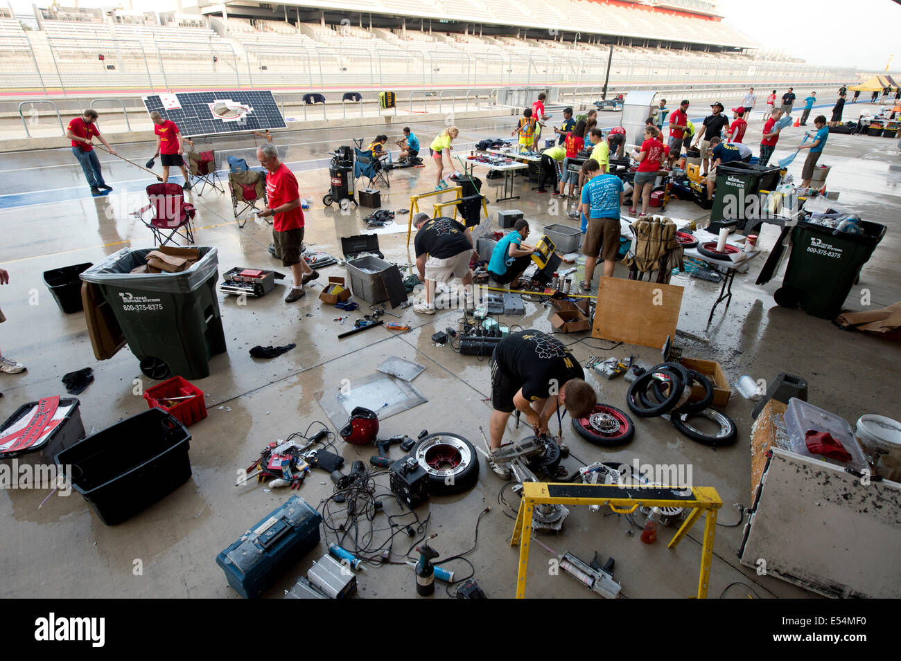 College race teams help clean equipment damaged in an overnight ...