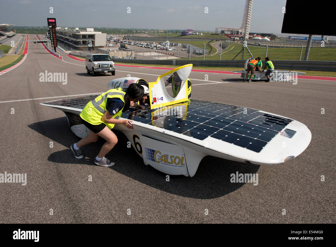 CalSol's solar car Zephyr is pushed up turn one during qualifying races ...