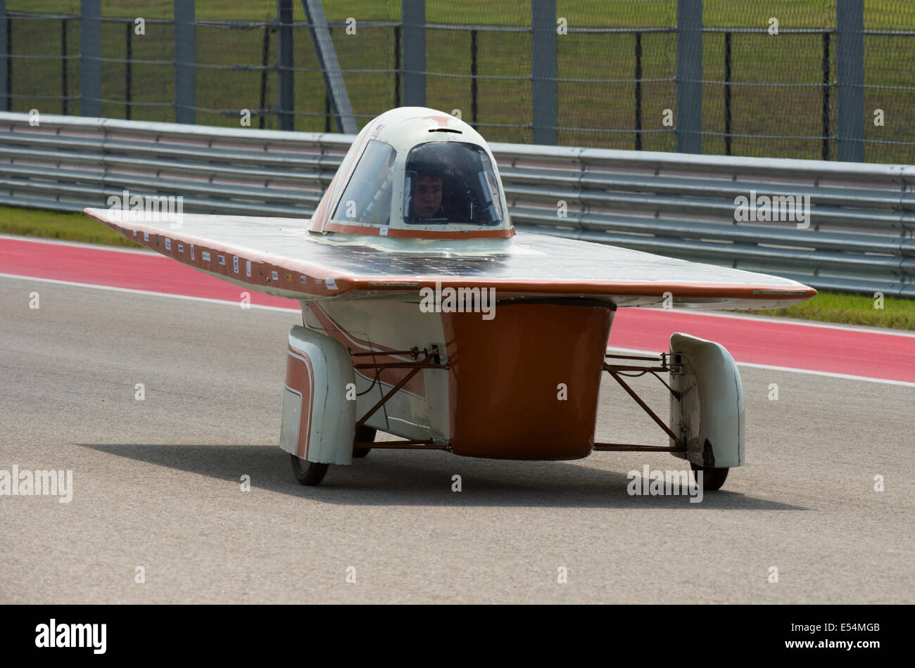 The University of Texas solar car, TexSun, heads up the track during ...