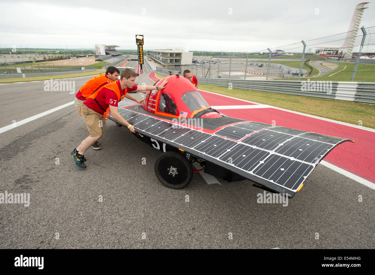Southern Illinois Univ. team members push their car during qualifying ...