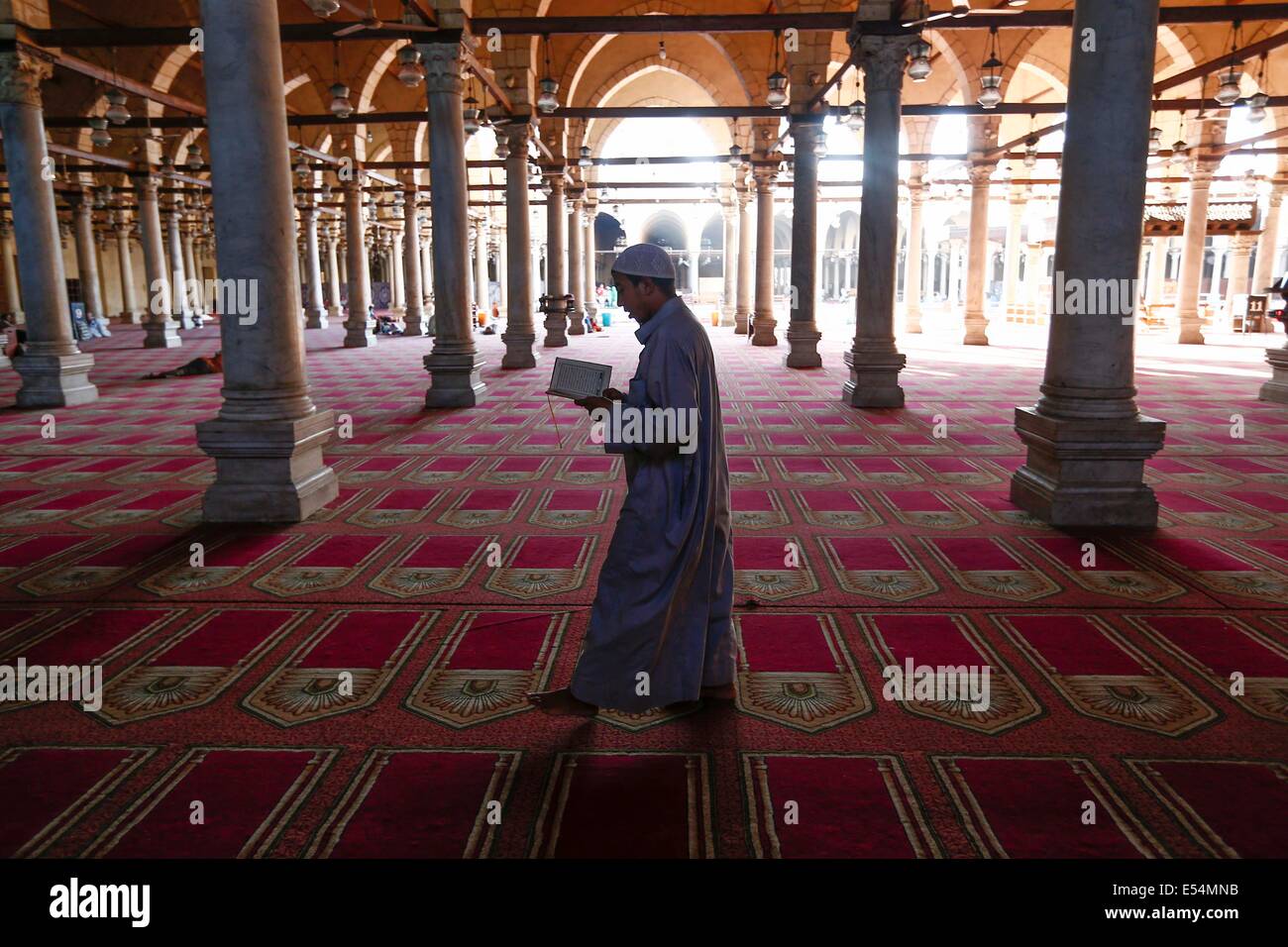 Cairo. 16th July, 2014. An Egyptian Muslim reads Quran in a mosque in ...