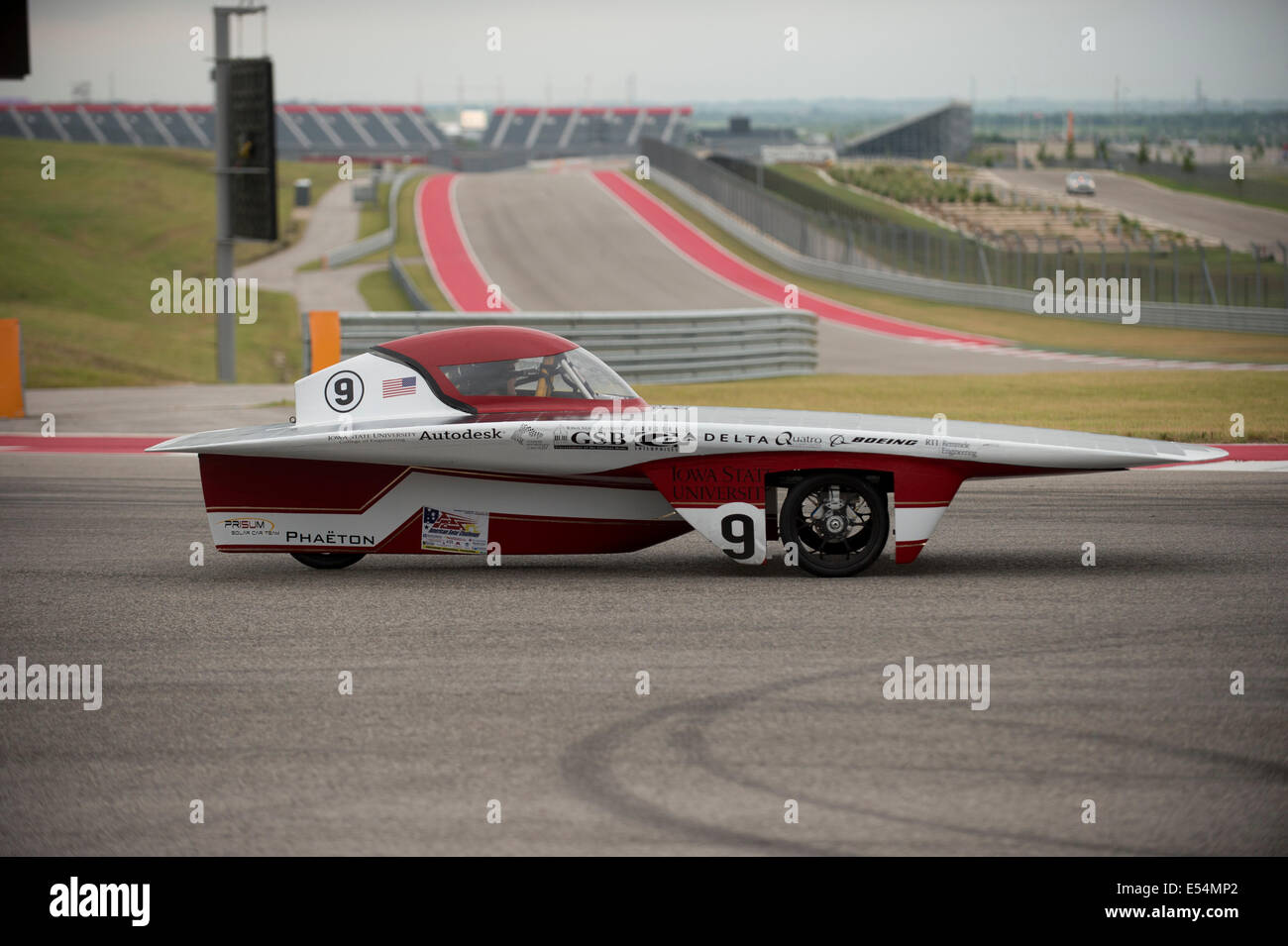 Iowa State University's solar car PrISUm, rounds a turn during a ...