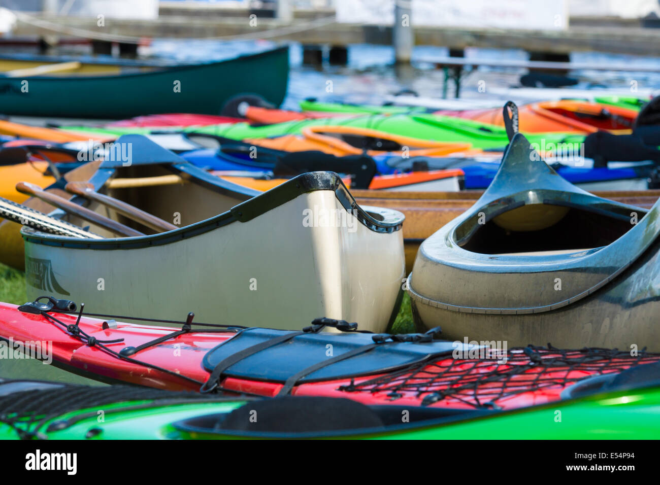 Sport boats, kayaks and canoes at the marina. Background Stock Photo ...