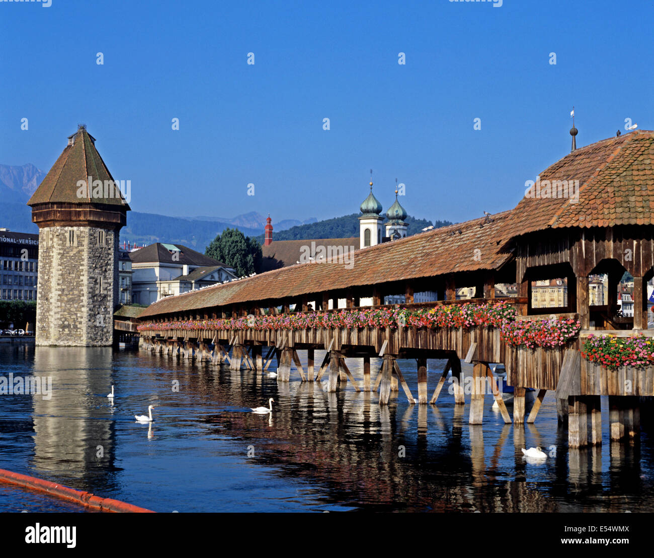 View of the Chapel Bridge across the Reuss River showing the water ...