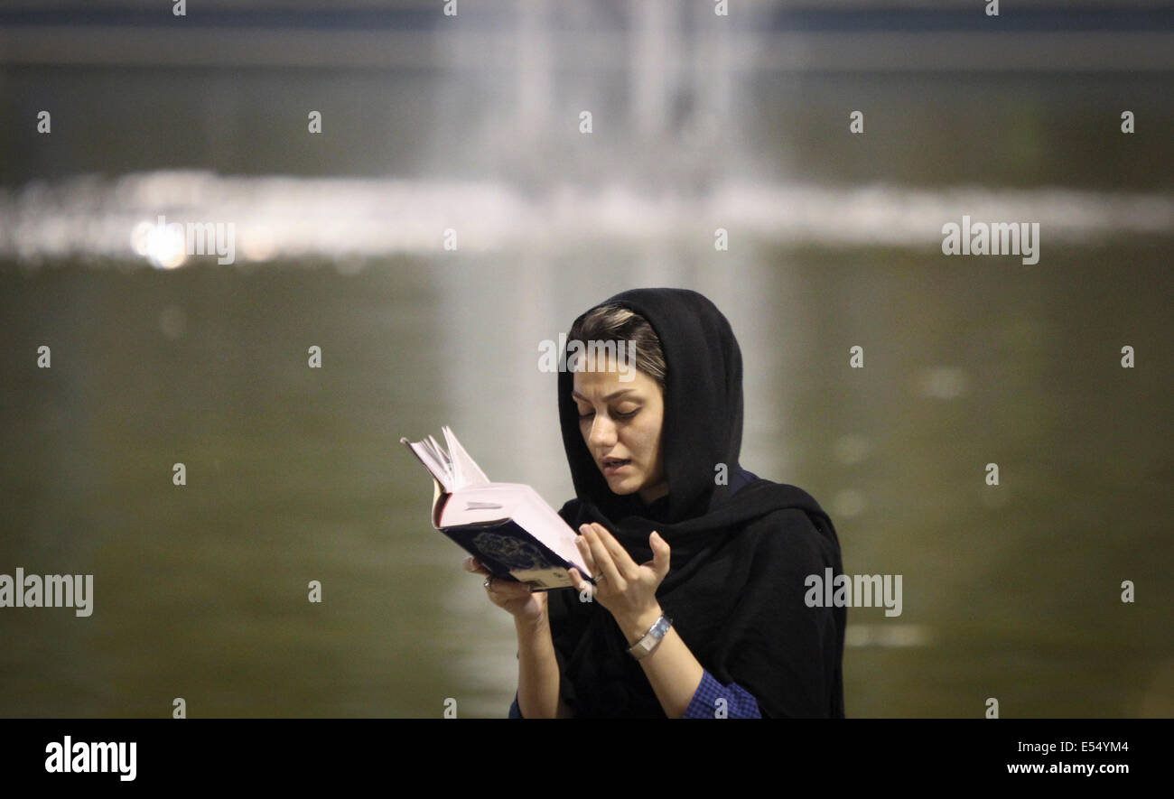 Tehran, Iran. 21st July, 2014. An Iranian Shiite Muslim prays during a ...