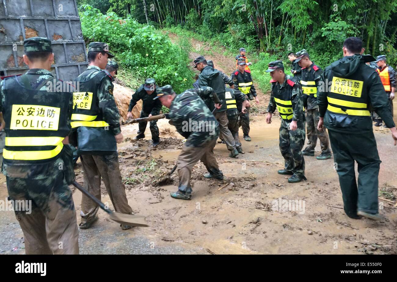 Kunming, China's Yunnan Province. 21st July, 2014. Rescuers conduct ...