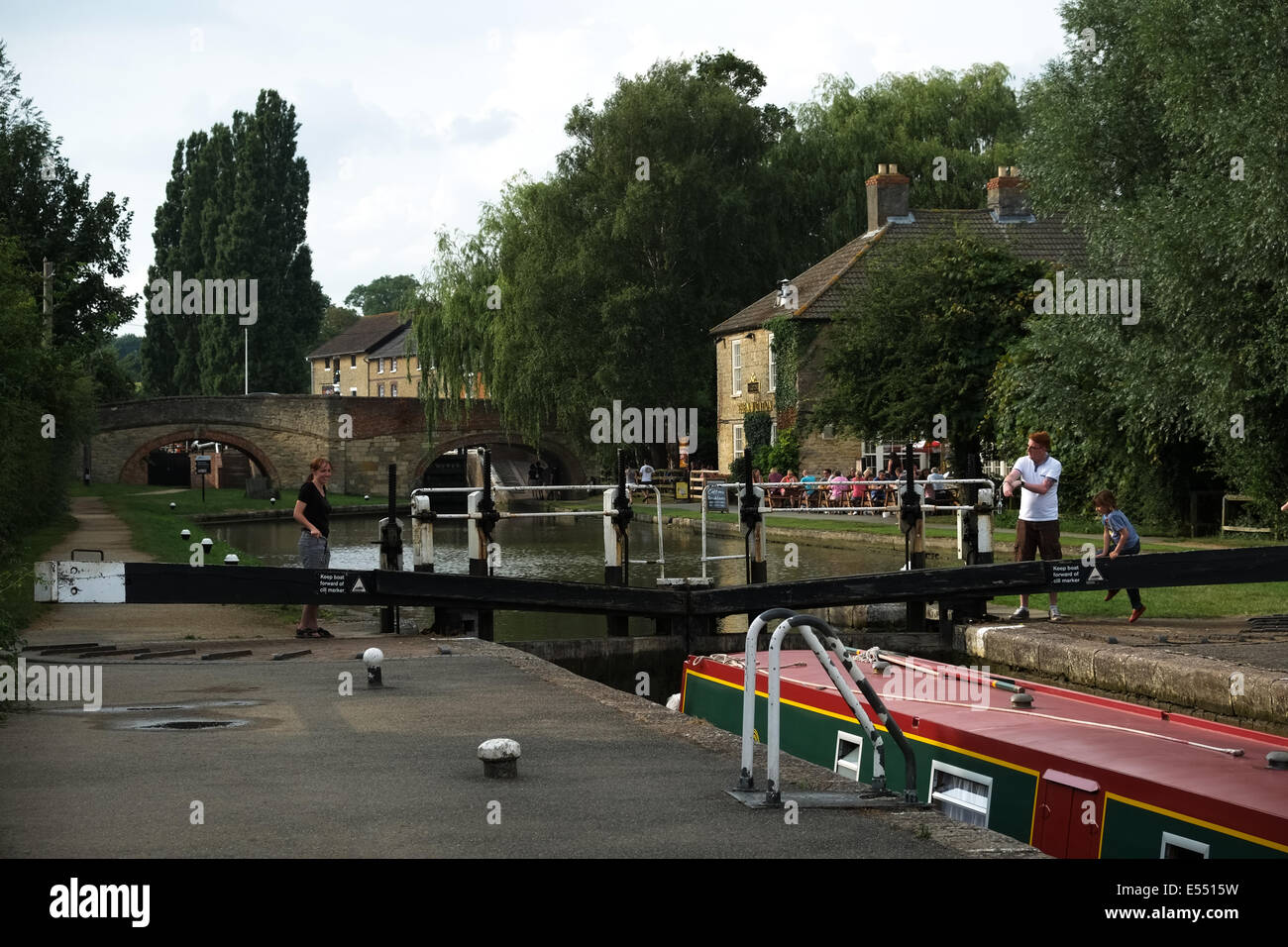 Barge being raised at a lock gate in Stoke Bruerne, Northamptonshire ...